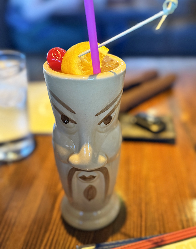 This isn't just any cocktail &ndash; it's a work of art served in a traditional tiki mug, garnished with fruit and promising tropical bliss with every sip.