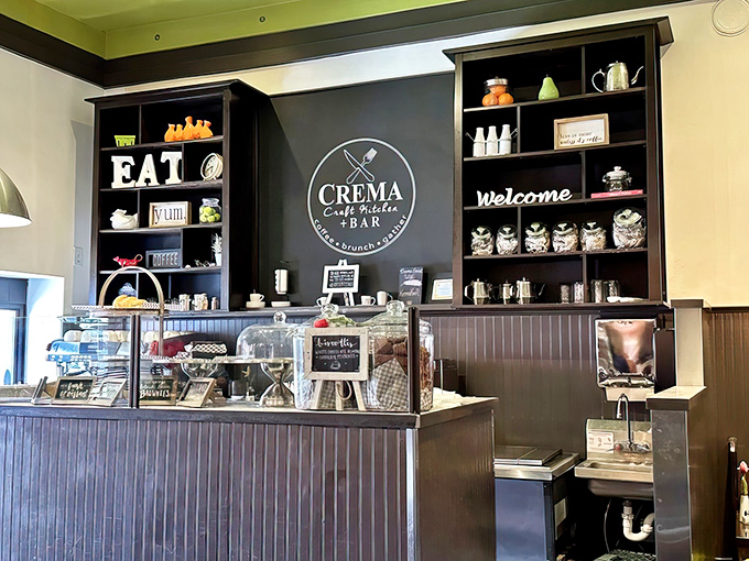 The counter showcases Crema's commitment to creating a welcoming space, with shelves adorned with charming knickknacks and coffee accessories.