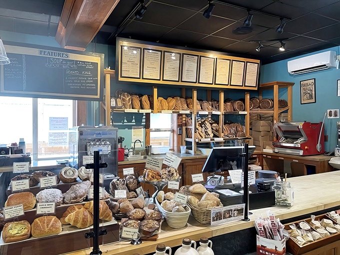 Behind the counter, a bread lover's dream&mdash;shelves lined with fresh-baked loaves just waiting to transform your sandwich game.