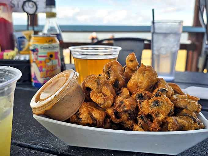 Golden-fried mushroom bites that disappear faster than your resolution to "just have one" &ndash; crispy outside, molten goodness inside.