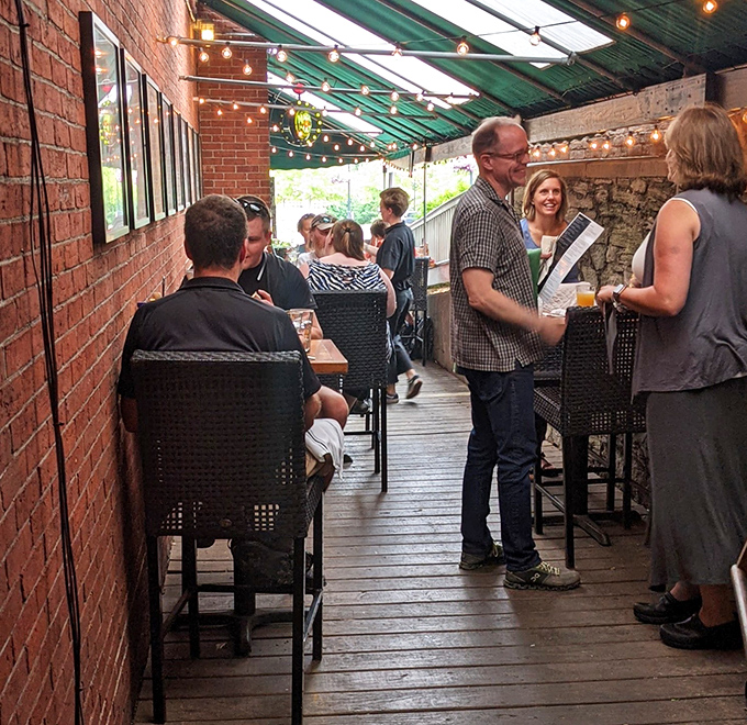 The covered patio becomes one of Montpelier's most sought-after dining spots, where string lights create magic as evening falls.