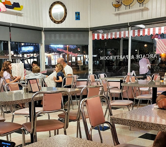 Families and friends gather in this timeless space where conversations flow as freely as the hot fudge on a sundae.