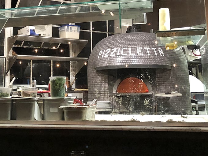 The heart of Pizzicletta: their magnificent tiled dome oven reaches the scorching temperatures needed for authentic Neapolitan pizza's signature char.