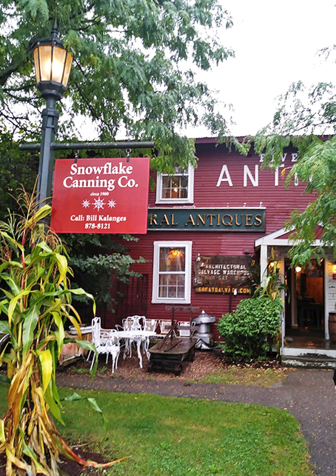 Summer greenery frames the historic red building, where Snowflake Canning Co. shares space with treasures from bygone eras.