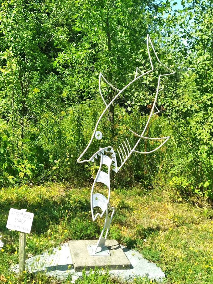 This whimsical wire wonder is swimming through a sea of green, no water required.