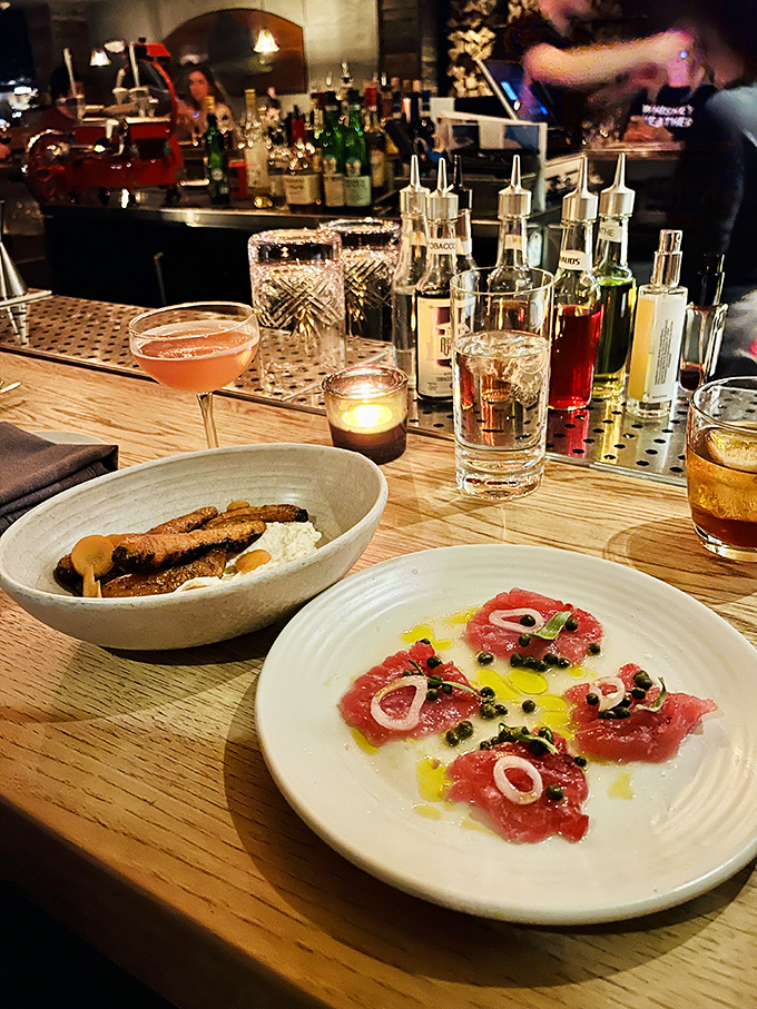 The bar's craftsmanship extends to the plate &ndash; delicate tuna crudo and hearty protein alongside cocktails that complement rather than compete with the food.