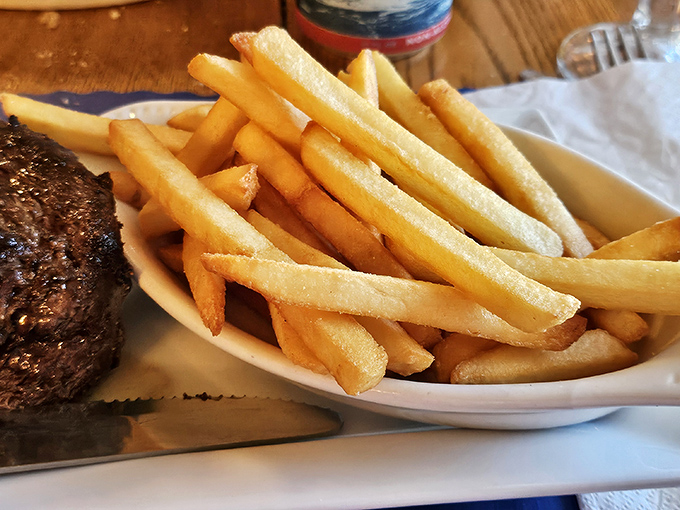 Golden fries with the perfect balance of exterior crispness and fluffy interior, hand-cut and cooked to potato perfection.