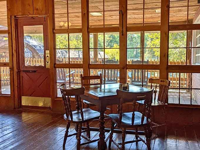 Inside seating areas feature wooden tables and windows overlooking the river, proving that ambiance matters just as much as what's on your plate.