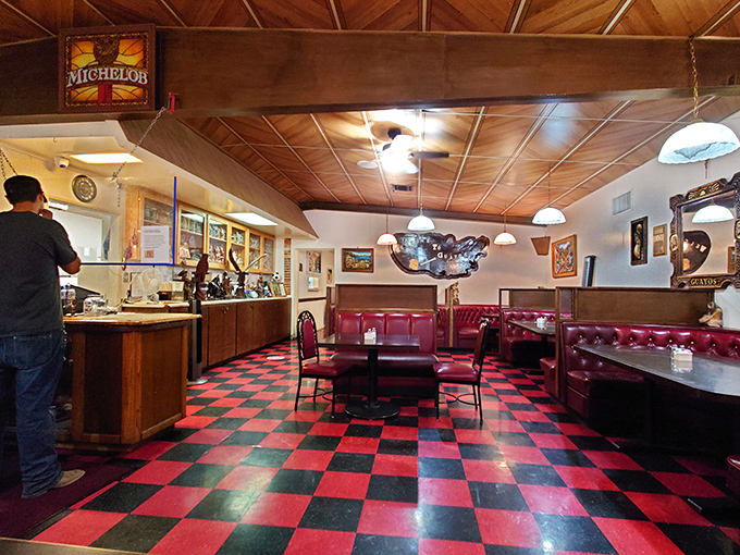 The dining room hums with conversation and laughter, a community gathering place where the checkerboard floor has witnessed decades of Arizona history.
