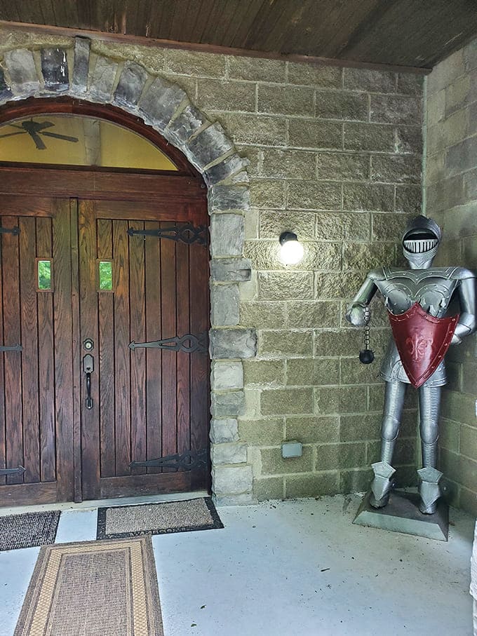 "Halt, who goes there?" A stalwart knight stands eternal guard beside massive wooden doors that open to fantastical adventures.