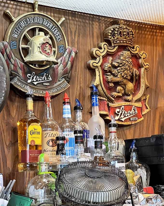 The bar's vintage beer signs and liquor selection create an atmosphere that's equal parts nostalgic and welcoming for today's crowd.