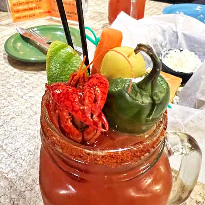 This Bloody Mary isn't just garnished—it's landscaped with an entire garden and crowned with a crawfish that demands respect.