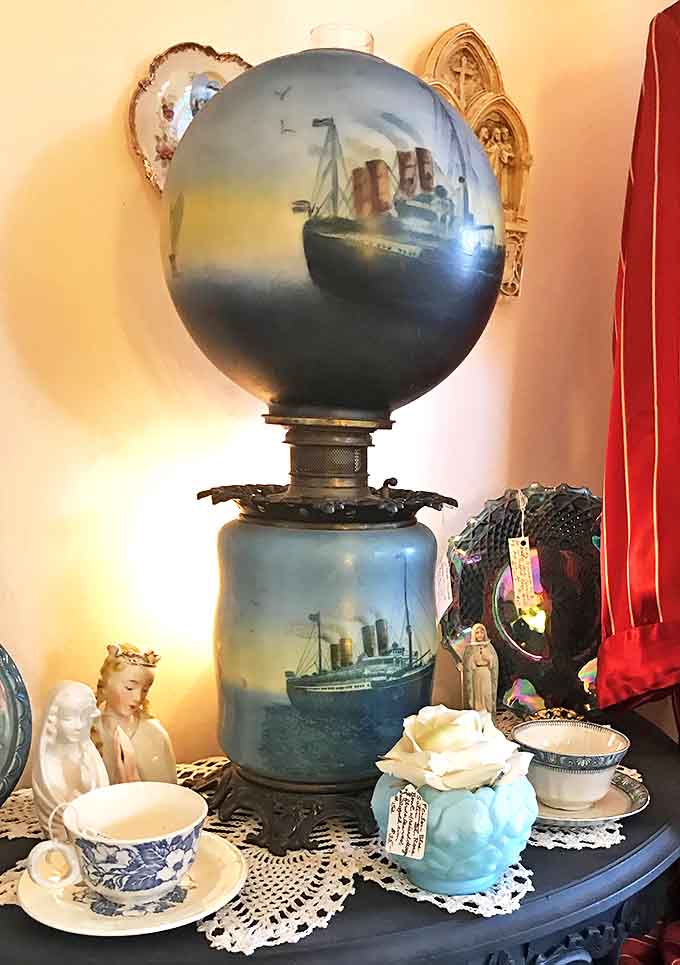 This remarkable ocean liner lamp casts a dreamy blue glow, transporting viewers to the golden age of transatlantic travel.