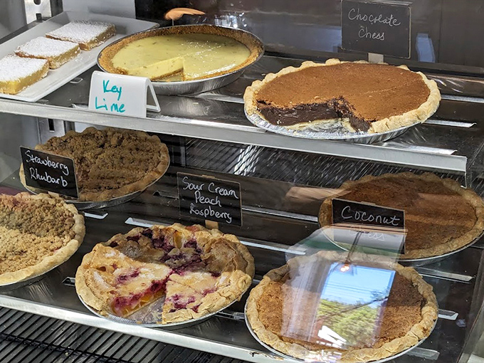 The pie case&mdash;or as I call it, "The Museum of Delicious Art." Key lime, chocolate chess, and berry creations await your careful consideration.