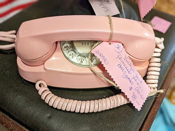 That distinctive pink rotary phone isn't just nostalgic decor &ndash; it's a functional piece of history waiting to ring in someone's retro-styled home.