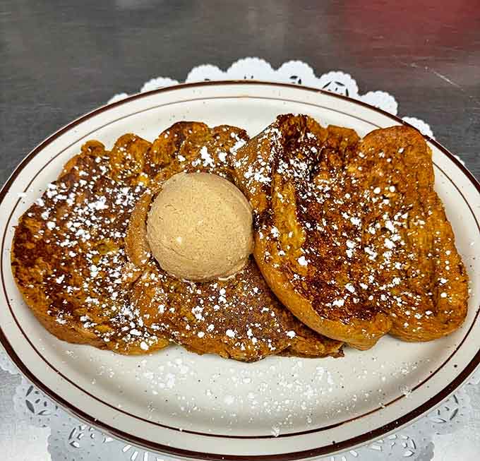 Pumpkin French toast dusted with powdered sugar transforms breakfast into a cozy autumn celebration any time of year.
