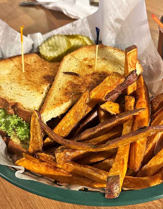 The sandwich-to-fry ratio here shows proper priorities &ndash; golden-brown perfection on both counts with a pickle for good measure.
