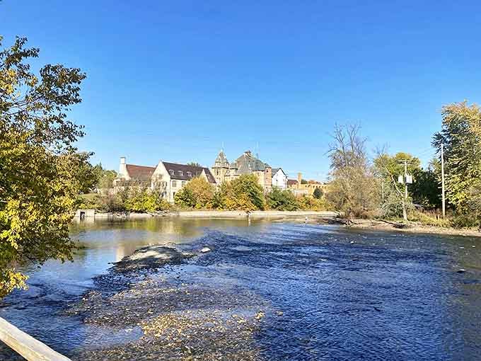 The river view showcases why Olmsted chose this location, with historic buildings reflected in water that's been flowing here longer than any of us.
