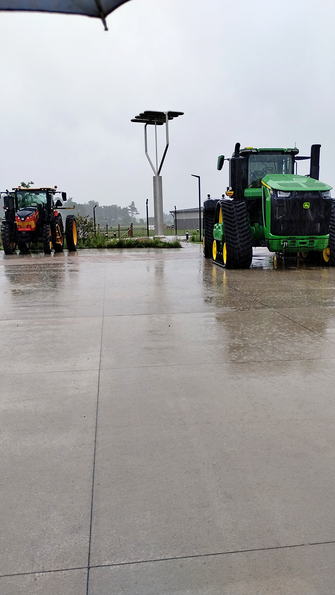 Even tractors pause to pay respect to this towering kitchen implement, recognizing a kindred spirit in agricultural equipment.