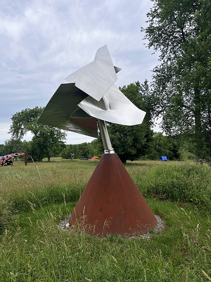 Kinetic elements catch Vermont breezes, adding gentle movement to this otherwise static installation.