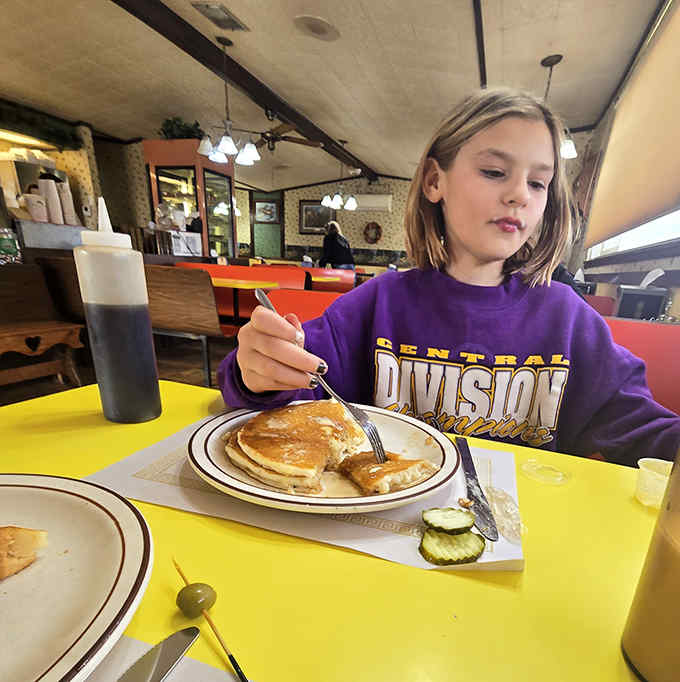 Pancakes that deserve their own moment of silent appreciation, served with a pickle spear because that's just how they roll.