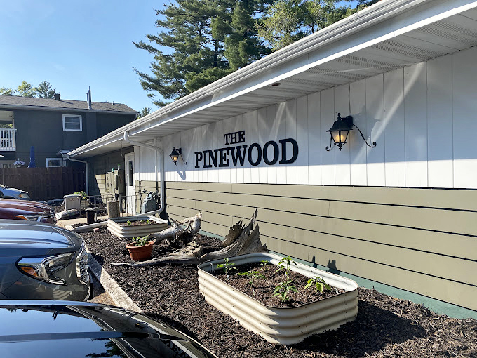 Where pines whisper and appetites roar. This simple sign marks the spot for a true Wisconsin supper club experience.