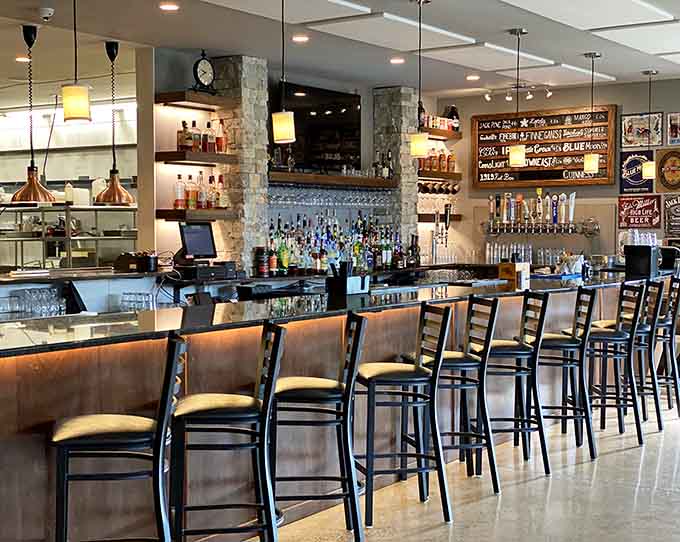 The well-stocked bar gleams with possibilities, from local craft brews to top-shelf spirits, all ready for your enjoyment.