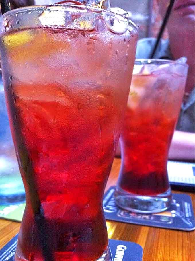 Alabama Slammers glow ruby-red in tall glasses &ndash; sweet-tart cocktails that deliver Southern charm with each refreshing sip.