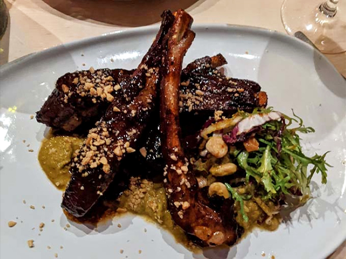 Glistening, sticky-sweet ribs with a perfect char. Fall-off-the-bone tender with a side of something green for balance (or conscience).