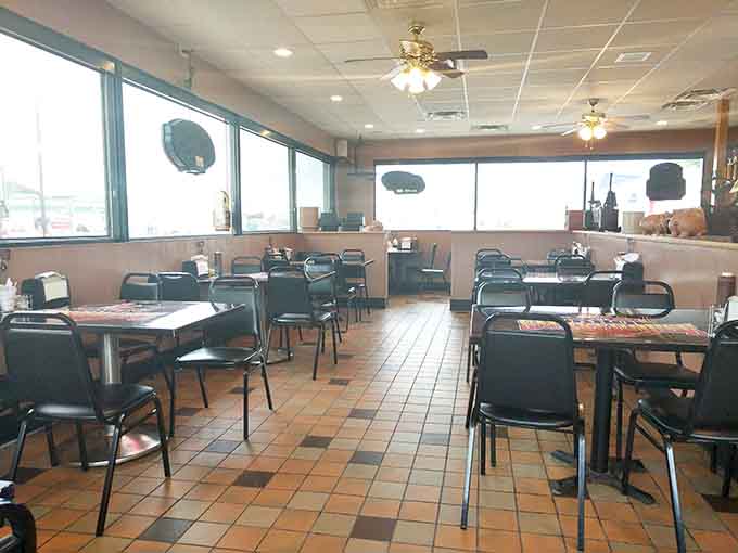 The dining room keeps it real with practical tables and chairs, because when the food is this good, you don't need mood lighting or fancy decor.