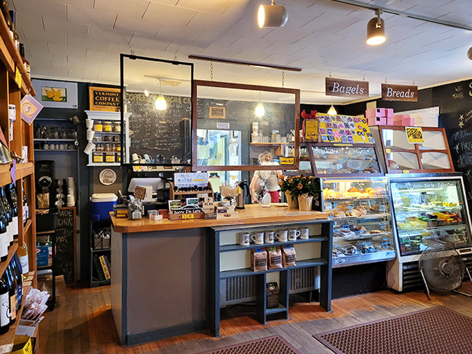 The coffee counter stands ready for literary fuel dispensing, with a chalkboard menu offering brews as carefully crafted as the stories on nearby shelves.