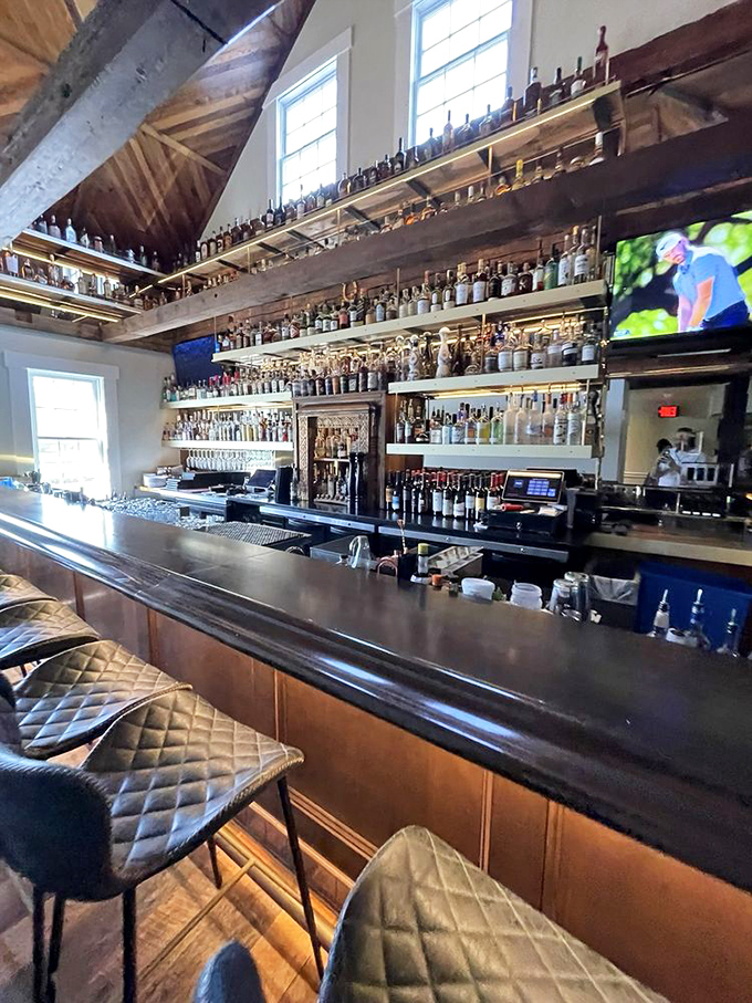 Where spirits are displayed like treasured artifacts and bartenders work their magic with the precision of seasoned artists.