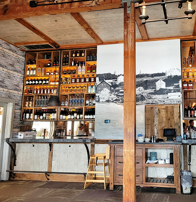 Where spirits stand at attention against weathered wood &ndash; a liquid library waiting to complement your seafood adventure.