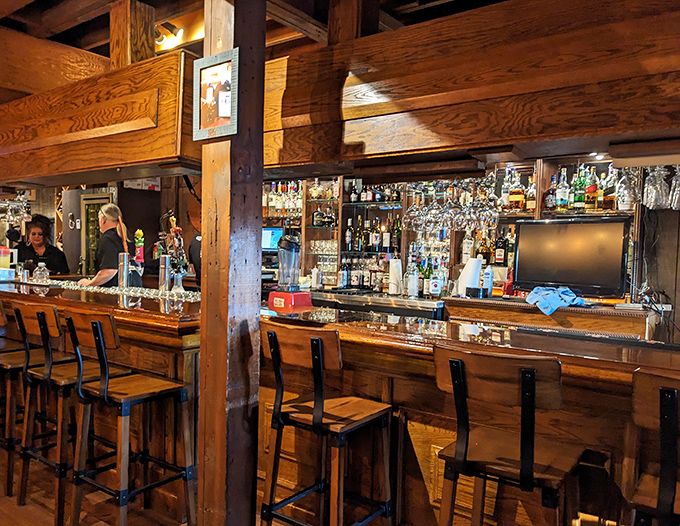 The well-stocked bar area offers a comfortable perch for solo diners or those waiting for tables during busy weekend rushes.