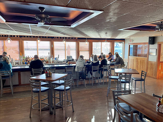 The bar area invites lingering conversations, where island news is exchanged and new friendships are formed over local brews.