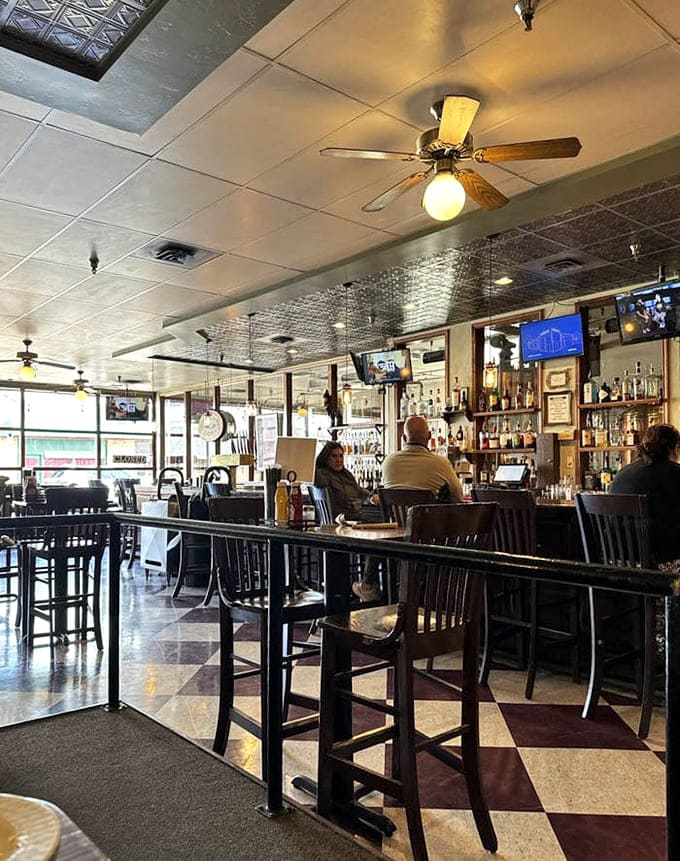 The bar where locals gather to solve the world's problems, one perfectly poured pint at a time, naturally.