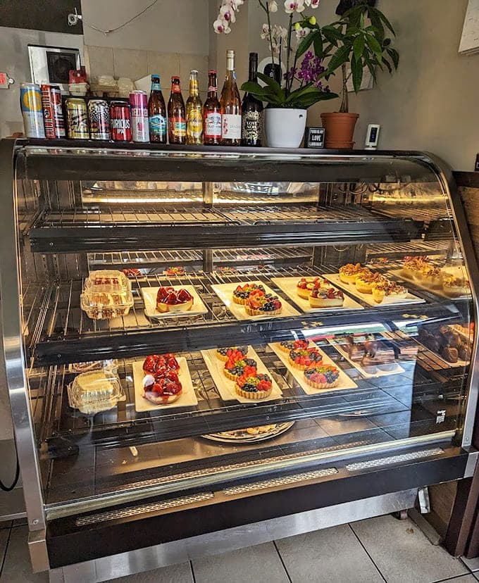 The pastry case displays its treasures like edible art, tempting you with colorful tarts and treats that make decision-making deliciously difficult.