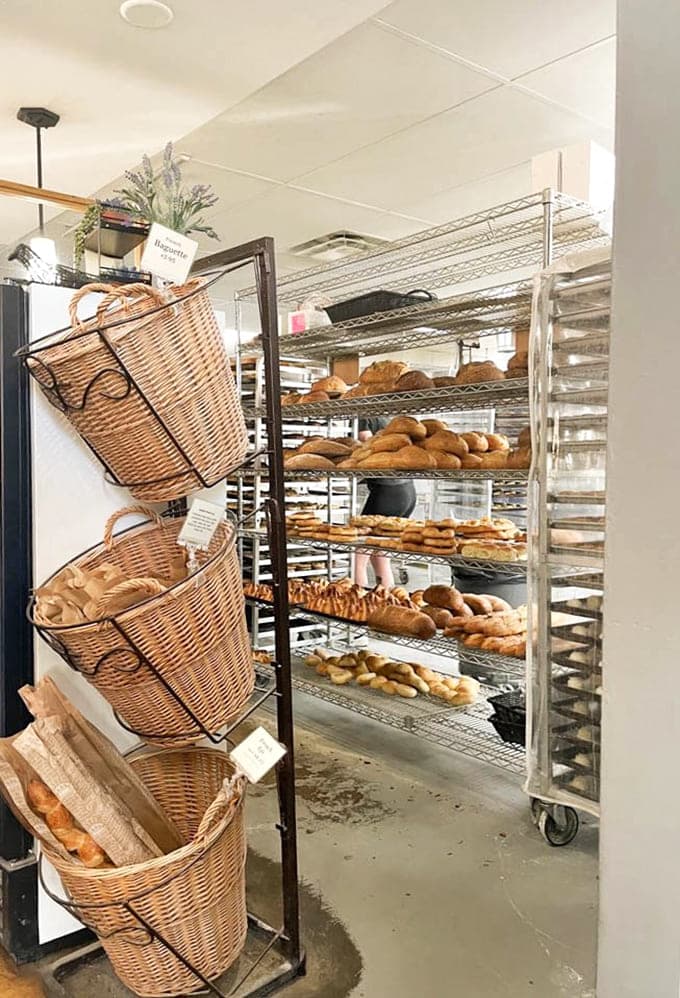 Behind the scenes, racks of fresh bread prove that good things come to those who wake up early.