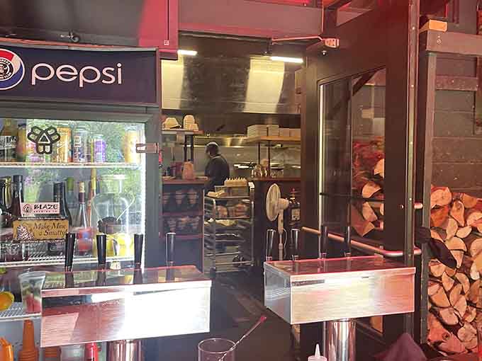 A glimpse into the kitchen reveals the wood-fired oven that adds distinctive flavor to many of Blaze's signature dishes.