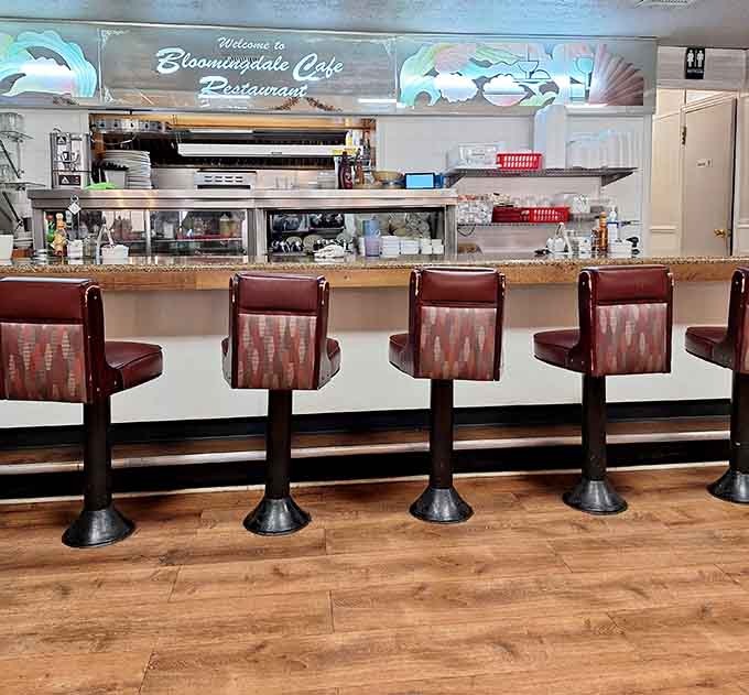 Counter seating offers front-row views of the kitchen magic happening behind that service window.