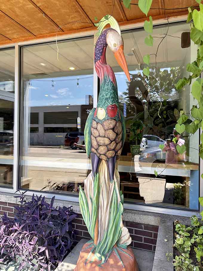 This whimsical painted heron sculpture adds personality to the entrance, proving that a sense of humor and good taste aren't mutually exclusive in restaurant decor.