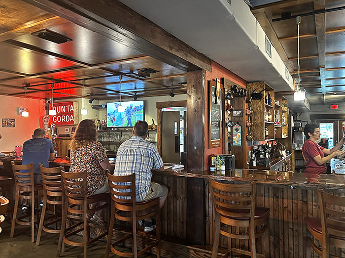 The bar area serves as command central for both libations and local gossip, all delivered with a smile.