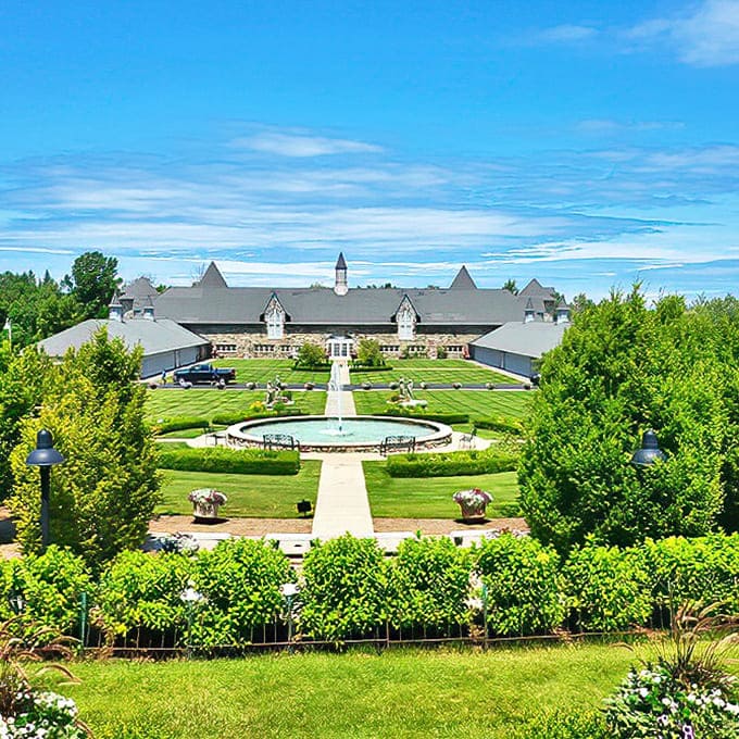 From above, the castle's perfect symmetry and formal gardens reveal themselves, a human-made marvel nestled into Michigan's natural landscape.