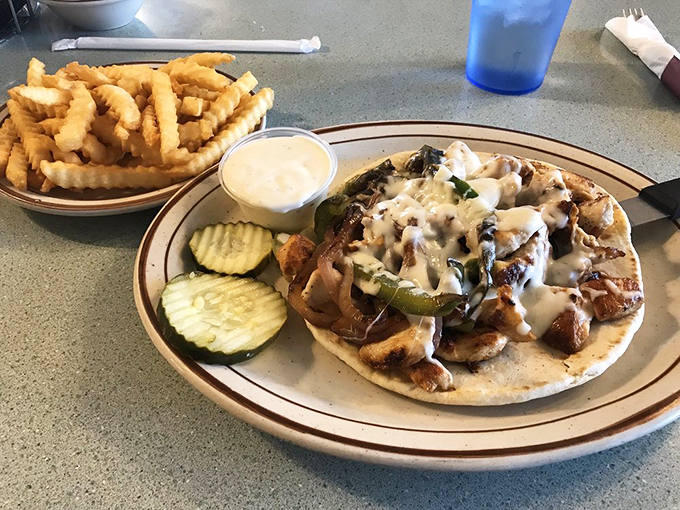 Tex-Mex meets Mediterranean in this handheld fiesta! Grilled chicken and veggies nestled in a warm pita pocket &ndash; it's a globetrotter's delight.