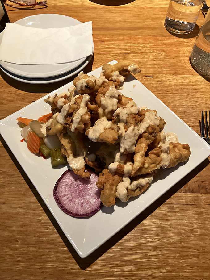 Crispy on the outside, tender within &ndash; these golden-fried delights with house-made dipping sauce elevate the humble chicken tender to new heights.