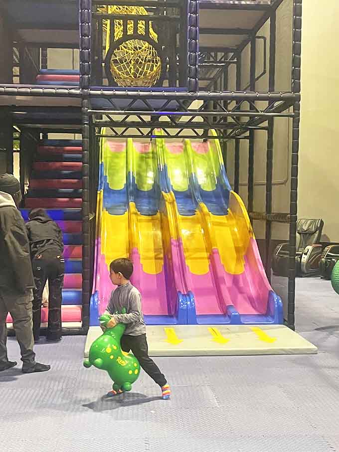 A young adventurer navigates the play area, demonstrating the universal truth that bouncing on inflatable objects never loses its appeal.