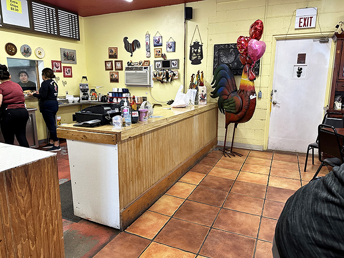 Counter Area: Where the magic happens &ndash; a collection of rooster figurines supervises the kitchen operations like feathered quality control managers.
