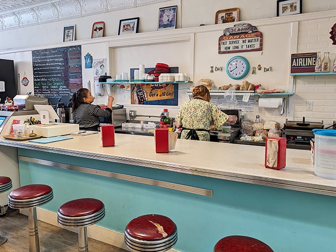Classic counter seating invites solo diners and new friends alike &ndash; these red vinyl stools have supported generations of ice cream enthusiasts.