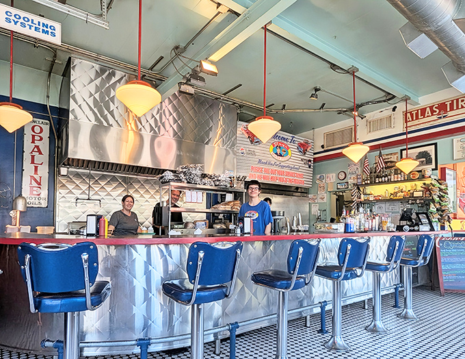 Chrome and vinyl time machines where elbows rest and stories unfold between bites.