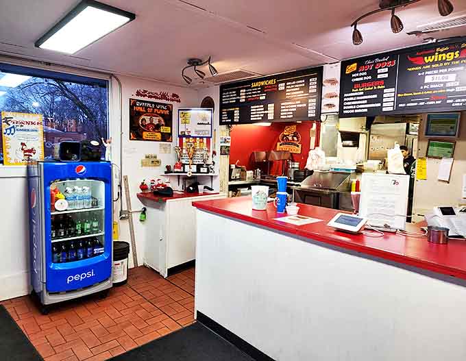Command central for wing operations – where sauce-slinging professionals turn out tray after tray of buffalo perfection with practiced efficiency.